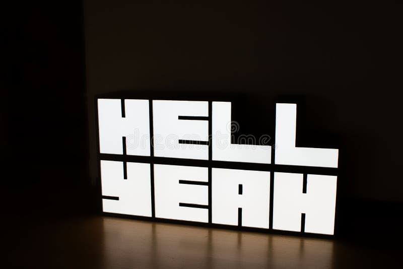 Neon White "Hell Yeah" Sign on the Table Stock Photo - Image of design ...