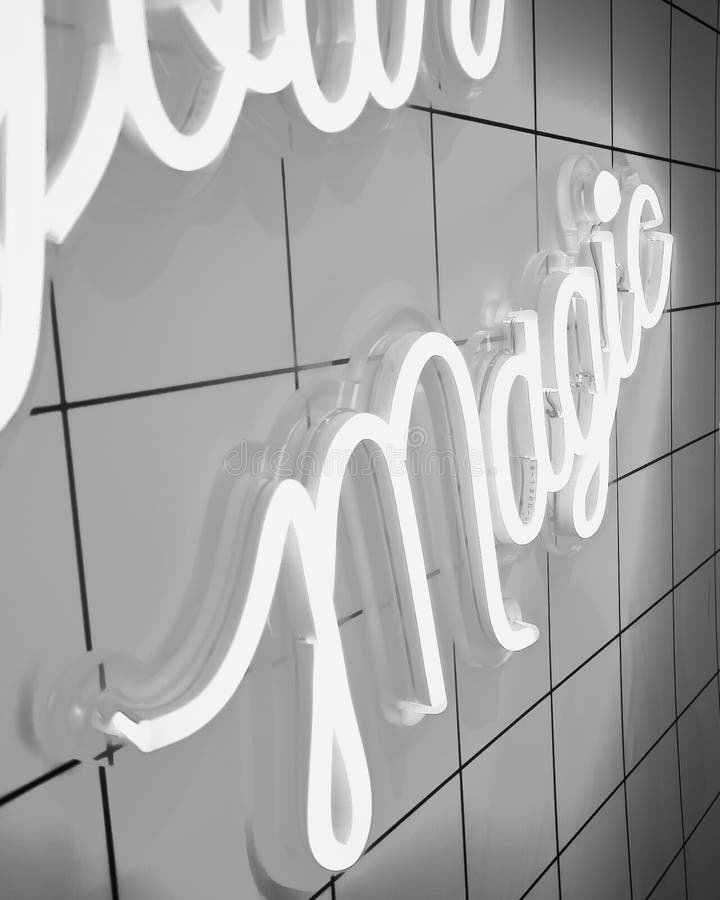 Neon Word Spelled Magic in Black and White Monochrome. Stock Image ...