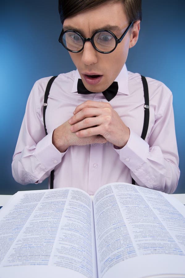 Nerd with book. stock image. Image of serious, holding - 33341715