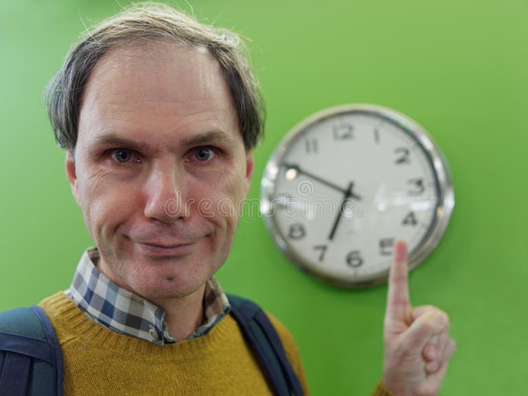 Nerd at a clock stock photo. Image of work, clock, male - 106123800