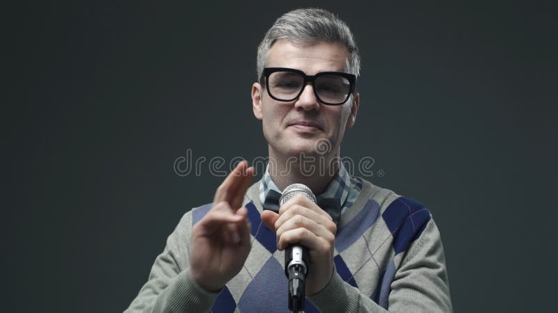 Nerd Guy Adjusting the Microphone before Giving a Speech Stock Footage ...