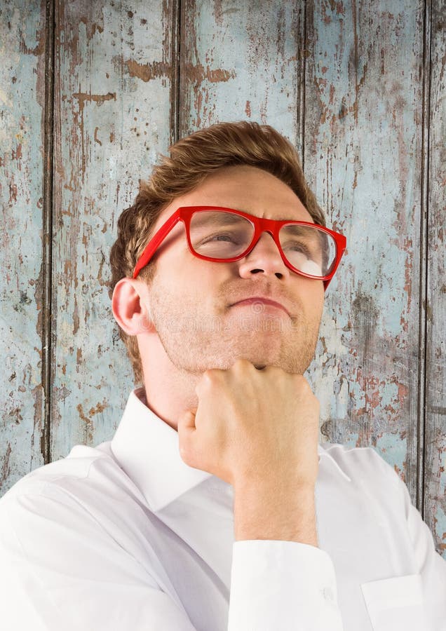 Nerd Man Thinking Against Wood Panel Stock Photo - Image of geek ...