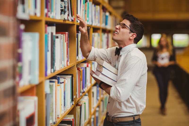 Nerd Searching Book while Girl Walking To Him Stock Photo - Image of ...