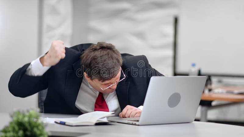 Nervous Business Man during Sudden Computer Failure Sitting on Desk in ...