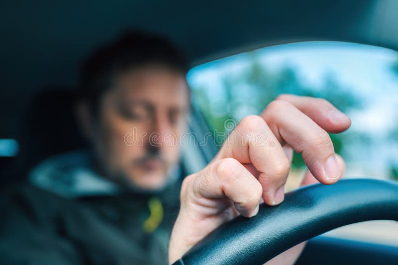 Nervous Driver Tapping Fingers on Car Steering Wheel while Waiting ...