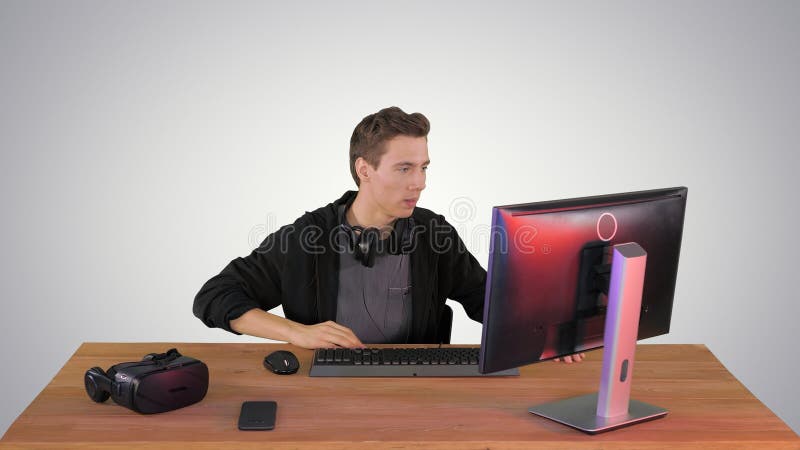 Nervous Man Watching Video Games on a PC Computer on Gradient Ba Stock ...