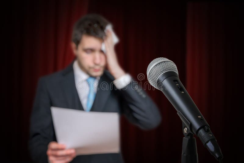 Nervous Speaker is Afraid of Public Speech and is Sweating. Microphone ...