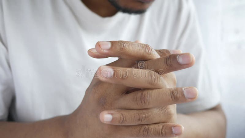A nervous young man hand stock footage. Video of wringing - 222285628