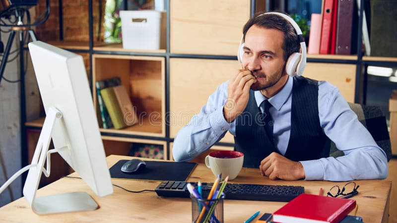 Nervously Biting His Nails, this Businessman Seems To Be Contemplating ...