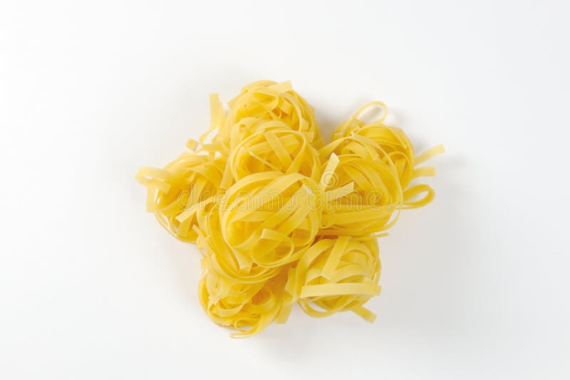 Nests of Dry Pasta Tagliatelle Stock Image - Image of studio, view ...