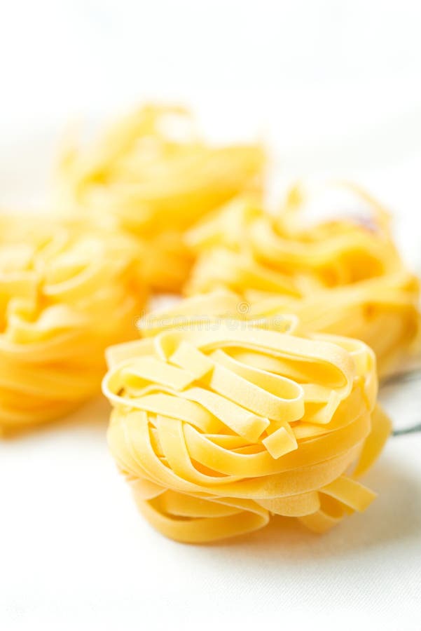 Dry Pasta Tagliatelle on Tablecloth Stock Photo - Image of kitchen ...