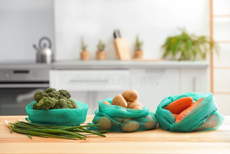 Net Bags with Vegetables on Table in Kitchen Stock Photo - Image of ...