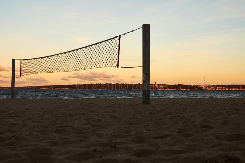 Net at the beach at sunset stock photo. Image of water - 60767000