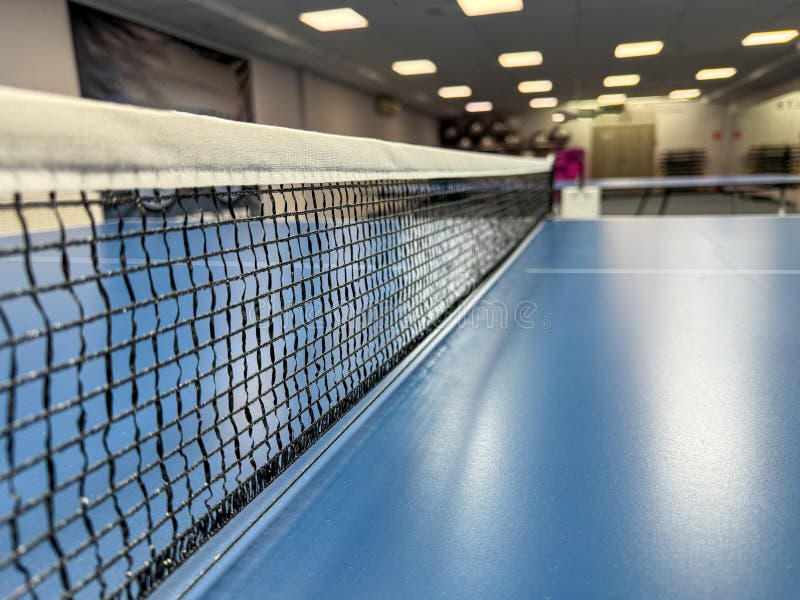 Net on a blue tennis table stock image. Image of match - 310755683