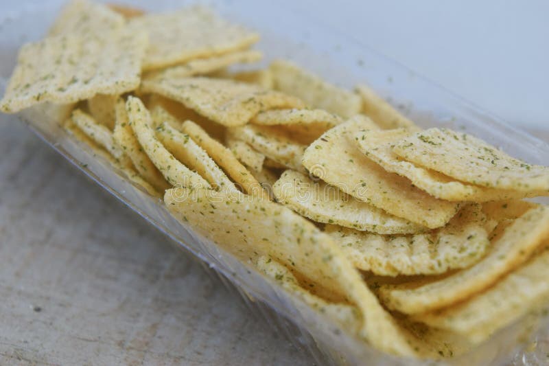 Net Chips in a Plastic Container that Tastes Good Stock Image - Image ...