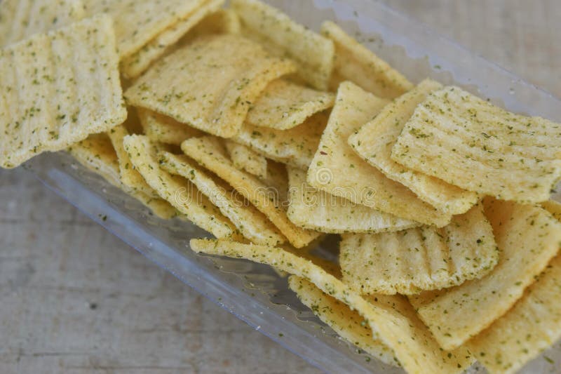 Net Chips in a Plastic Container that Tastes Good Stock Image - Image ...