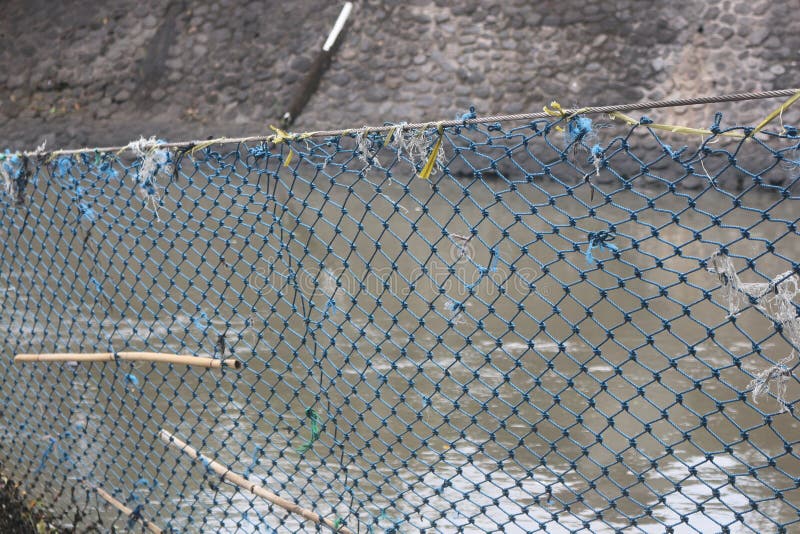 A Net Installed in a River that Serves To Hold and Collect Garbage ...
