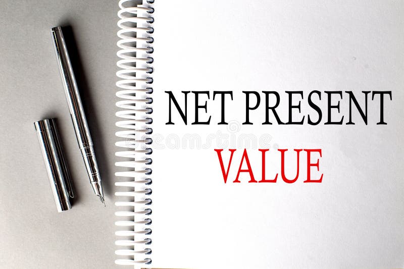 NET PRESENT VALUE Text on a Notebook with Pen on Grey Background Stock ...