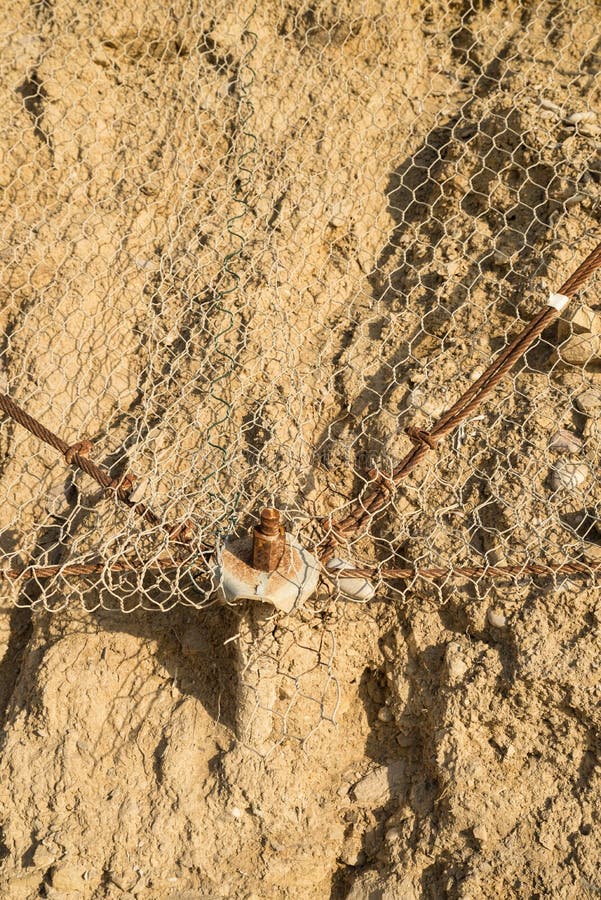 Netting on a cliff stock image. Image of netting, falling - 65885551