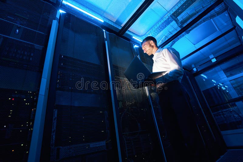 Network Administrator Using Laptop while Doing Computer Equipment ...