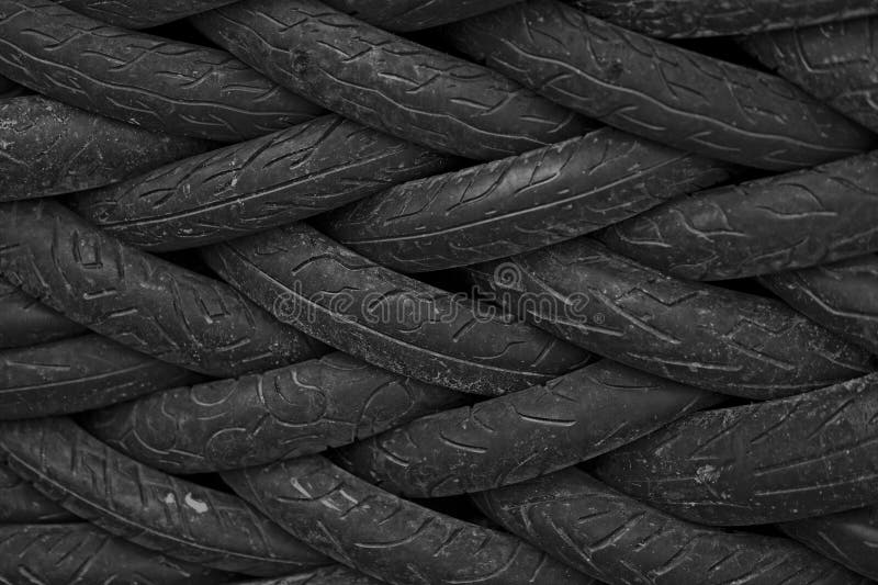 A Network of Black and White Used Tires, Carefully Interwoven, Forms a ...