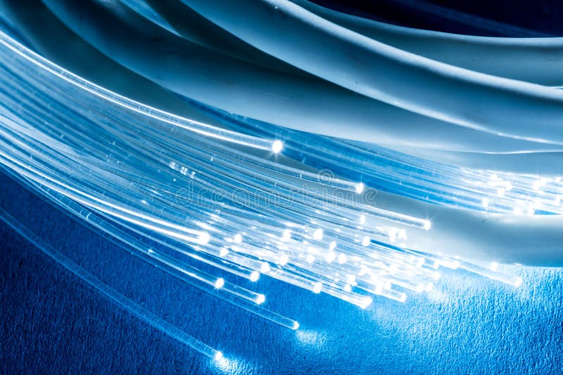 Network Cables and Optical Fibers with Light on Blue Background Stock ...