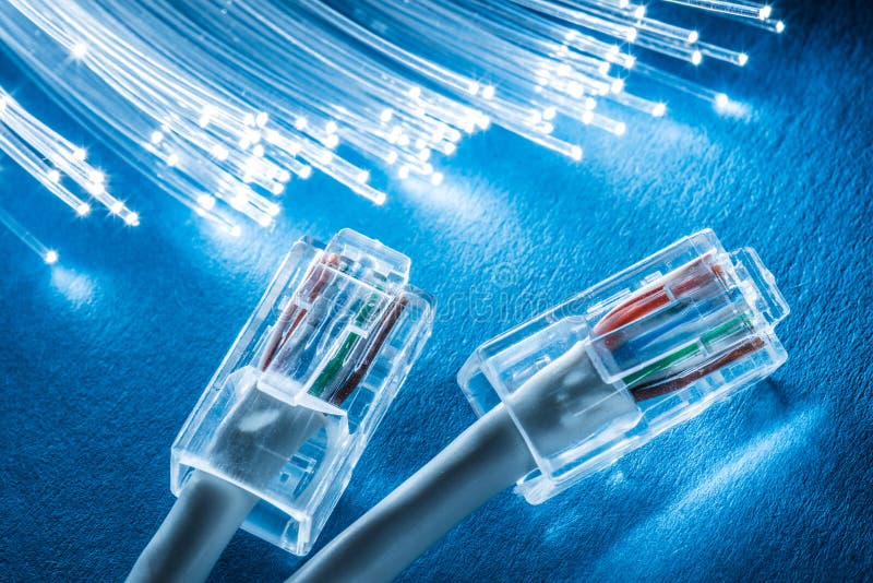 Network Cables and Optical Fibers with Light on Blue Background Stock ...