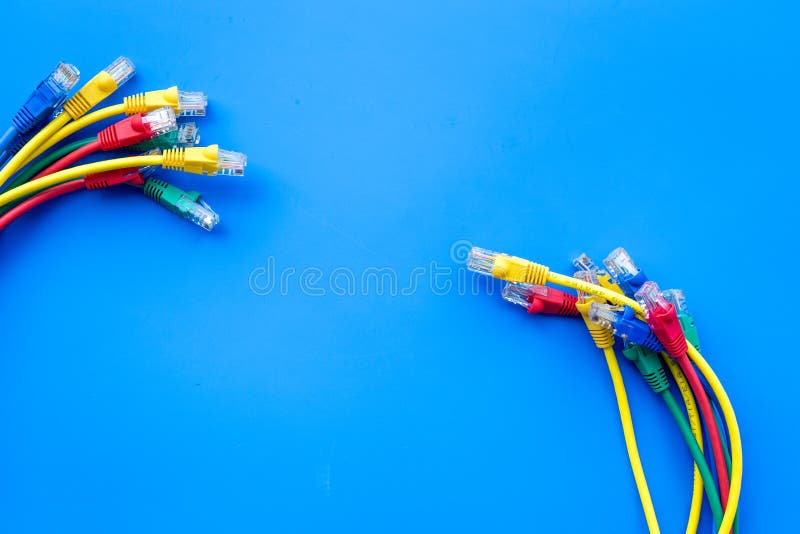 Network Colored Cables for Computer on Blue Background Top View ...