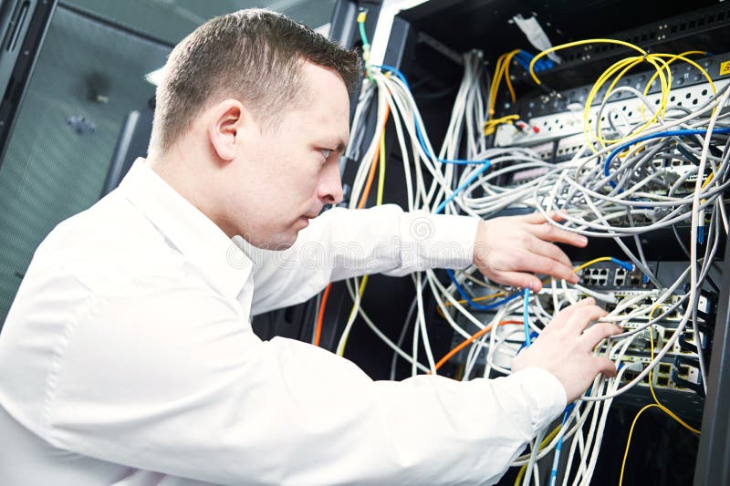 Network Engineer in Server Room Stock Photo - Image of engineer ...