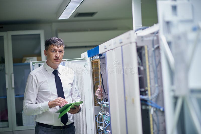 Network Engineer Working in Server Room Stock Photo - Image of ...