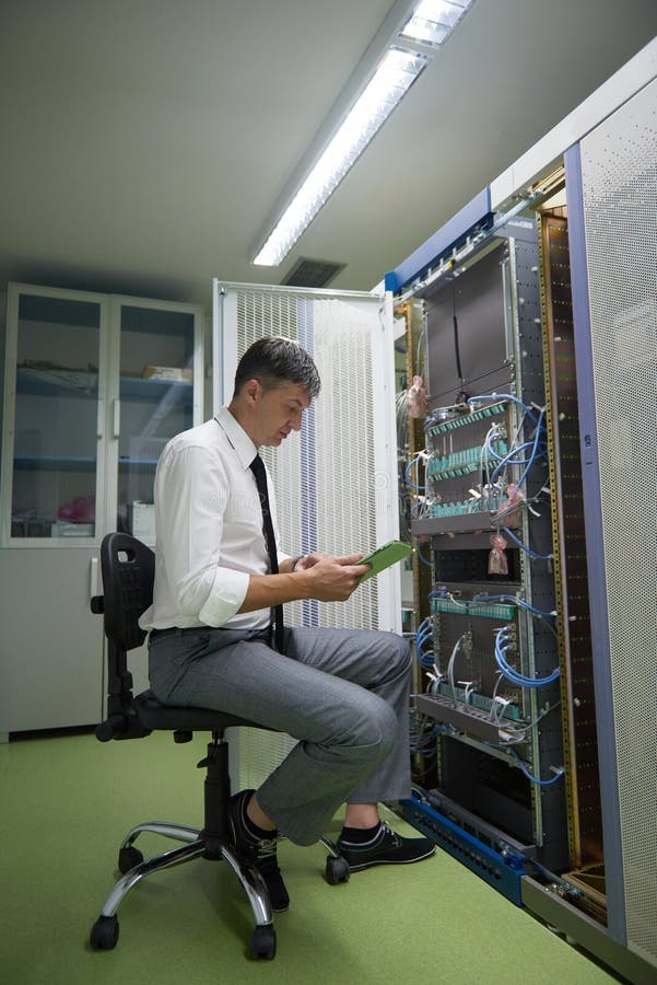 Network Engineer Working in Server Room Stock Photo - Image of male ...