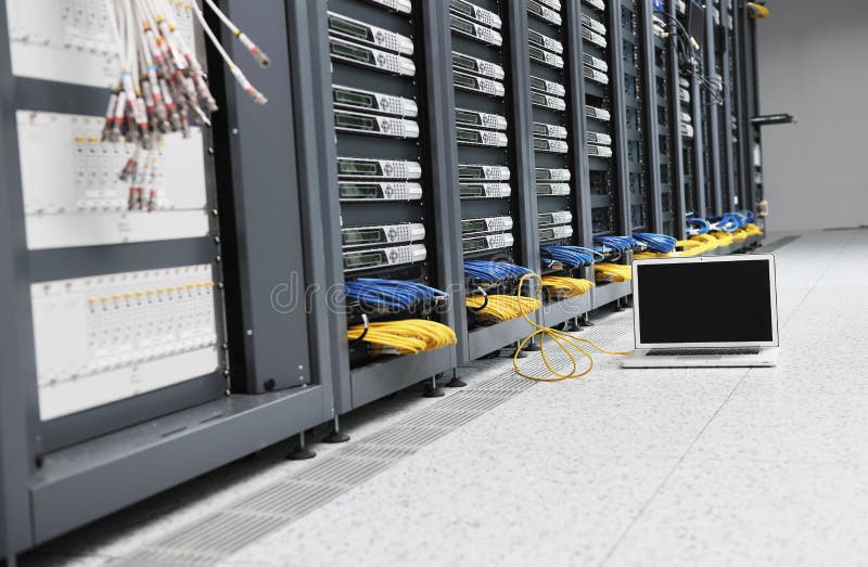 Businessman with Laptop in Network Server Room Stock Photo - Image of ...