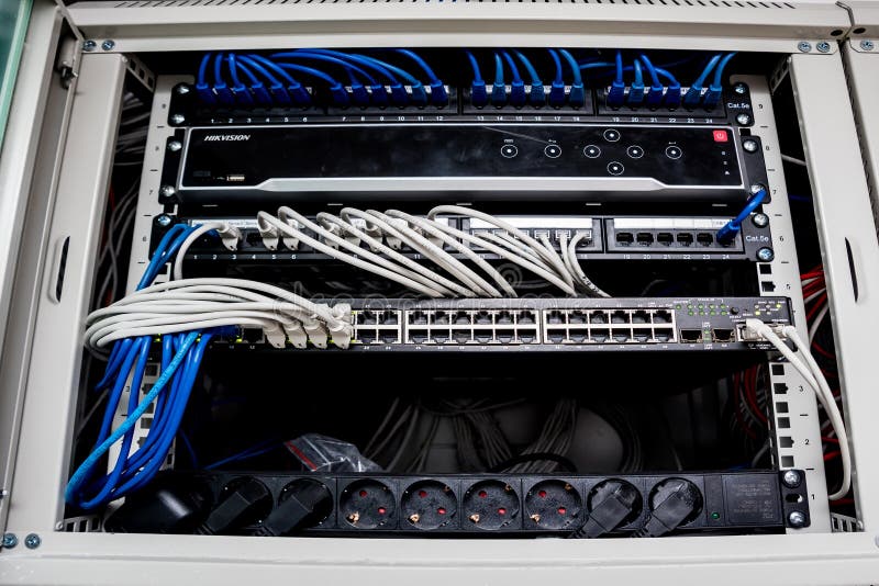Network Switch and Ethernet Cables in Red and White Colors. Data Center ...