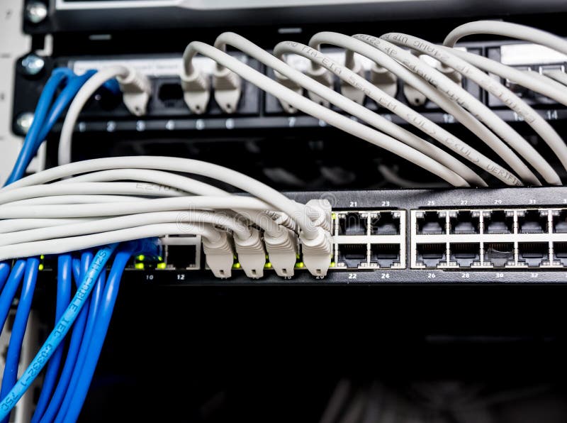 Network Switch and Ethernet Cables in Red and White Colors. Data Center ...