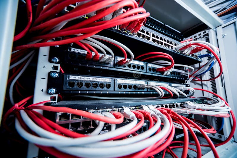 Network Switch and Ethernet Cables in Red and White Colors. Data Center ...