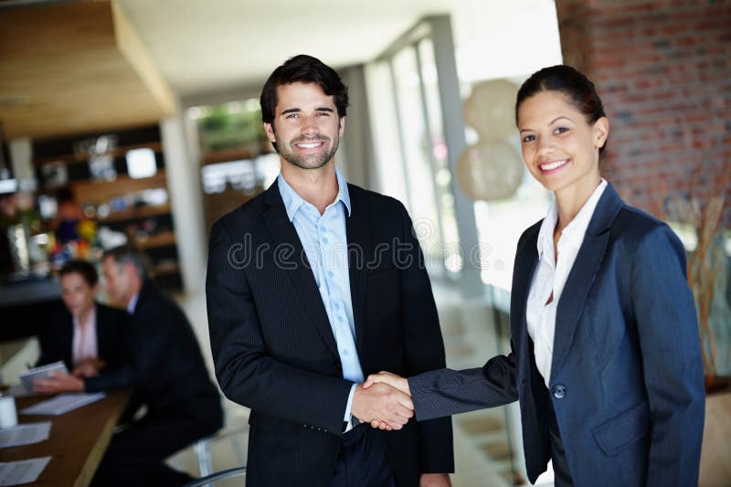 Networking with a Client. a Smiling Businessman Shaking Hands with a ...