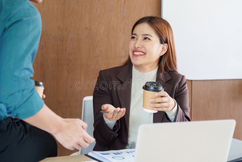 Networking and Collaboration. a Smiling Professional Sharing Coffee ...