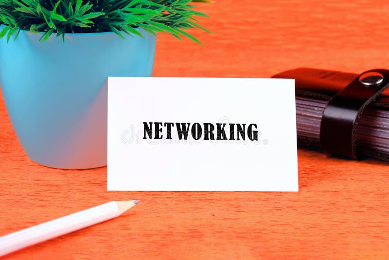 NETWORKING Word Written on a White Business Card on an Orange ...