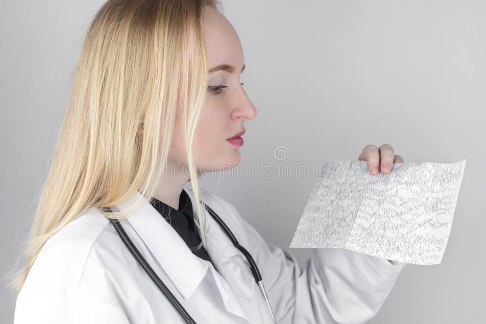 A Neurologist Examines an Encephalogram of a Patientâ€™s Brain ...