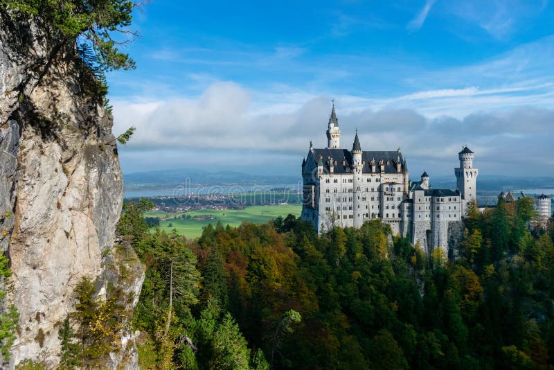 Neuschwanstein Castle in Alps with Cliff in Autumn with a Village at ...