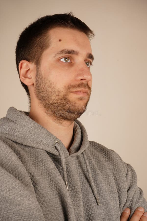 Neutral Background. Guy in Casual Clothes. Young Man Standing in Front ...