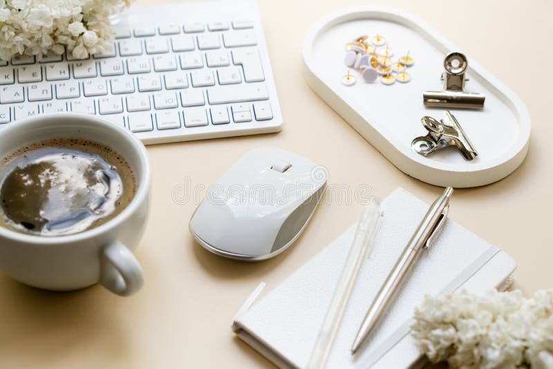 Neutral Color Tabletop with Pc Keyboard, Notepad and White Flowers ...