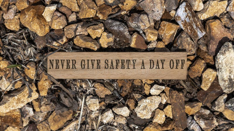 Never Give Safety a Day Off. Written on Wooden Surface Stock Image ...