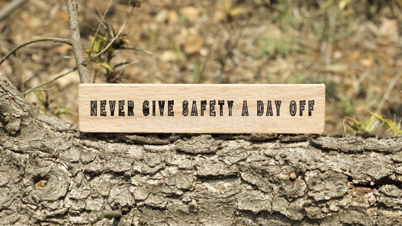 Never Give Safety a Day Off. Written on Wooden Surface Stock Image ...