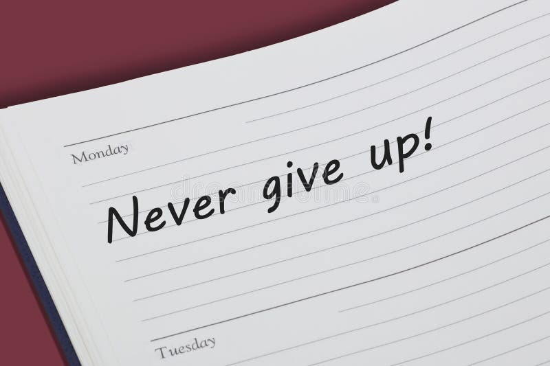 Never Give Up Reminder Message in an Open Diary Stock Photo - Image of ...