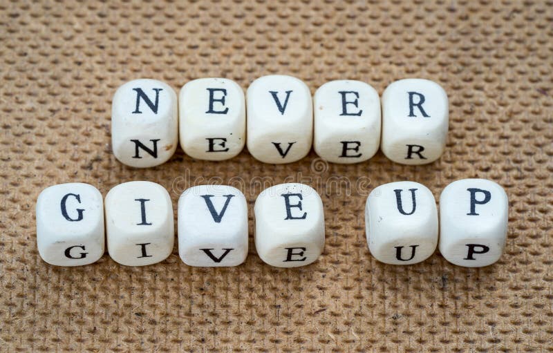 Never give up stock image. Image of cube, bricks, letter - 97411431