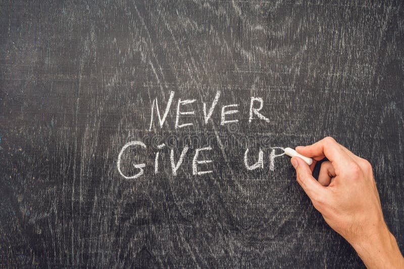 Never Give Up Words Written on the Chalkboard Stock Image - Image of ...