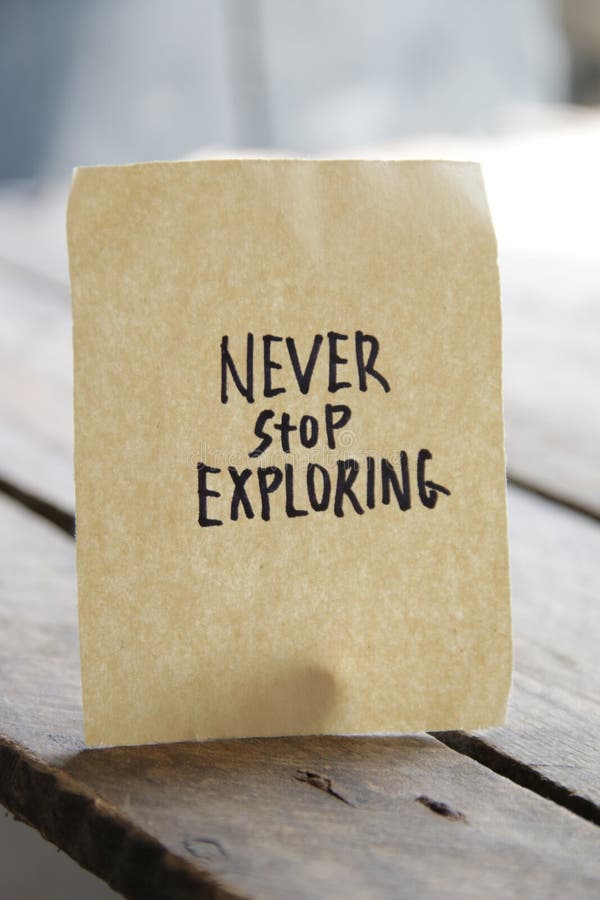 Never Stop Exploring Idea. Writing on a Piece of Paper Stock Photo ...