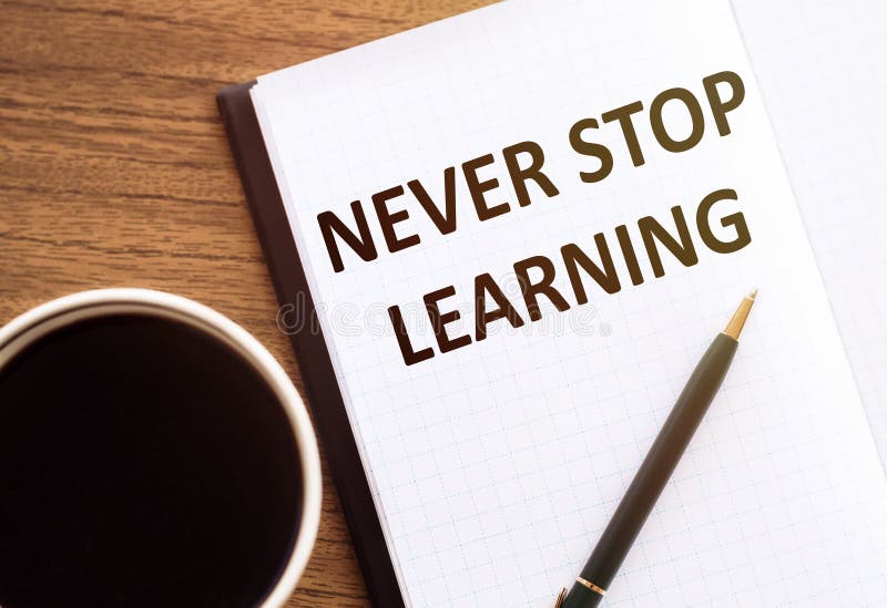 NEVER STOP LEARNING - Text on Notepad on Wooden Desk Stock Photo ...