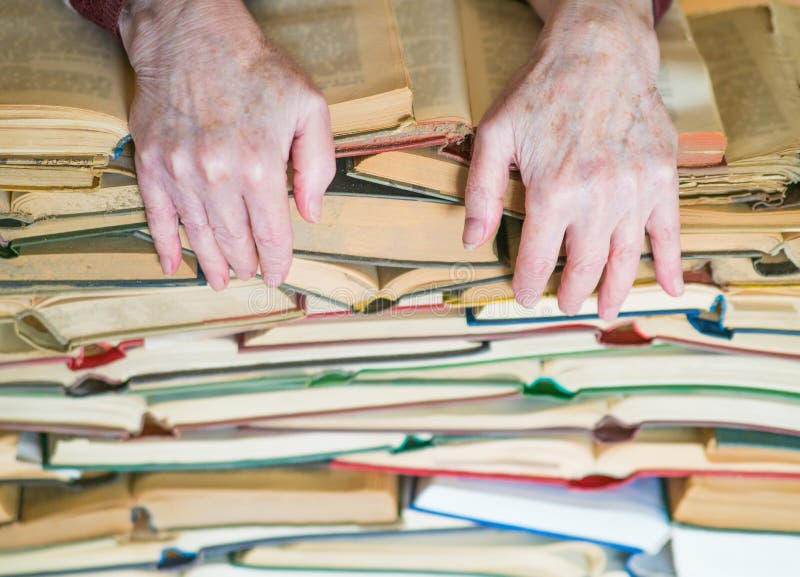 Never Too Old To Learn - Hands of Old Woman Reading Book Stock Photo ...